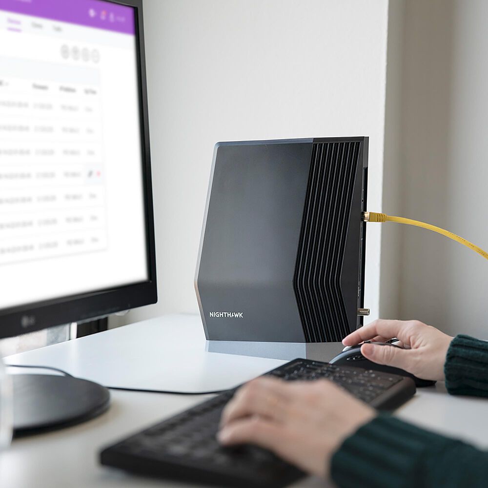 NETGEAR Nighthawk AX8 8-Stream Wi-Fi 6 Cable Modem Router in Black | NFM